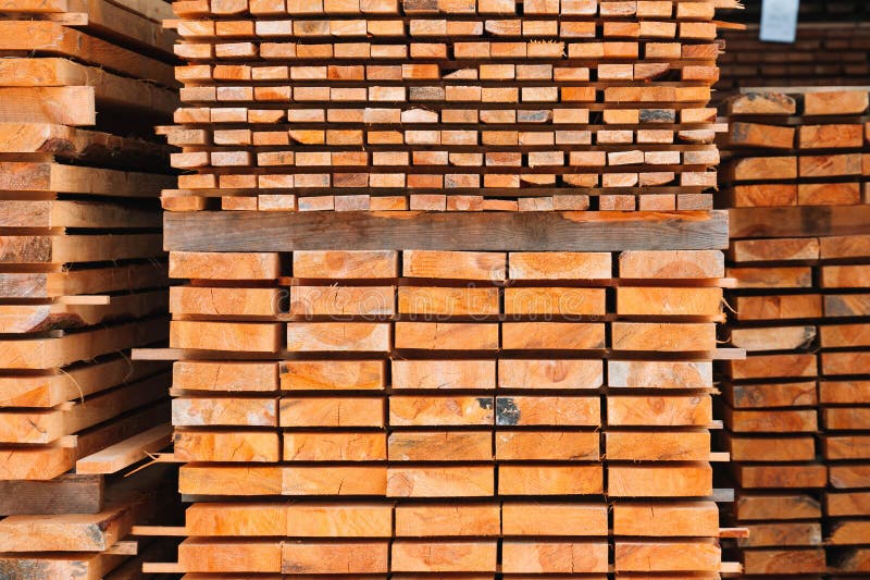 Lumber in a Large Warehouse. Wooden Boards in the Stack Stock Photo ...