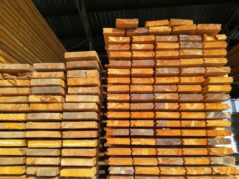 Lumber in Large Warehouse. Wooden Boards in the Stack. Edged Board ...