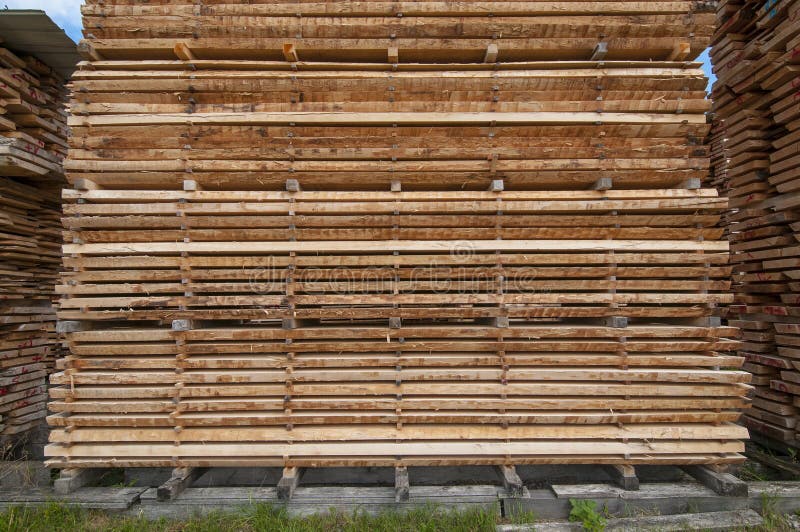 Lumber yard, wooden boards stock image. Image of grain - 140303943