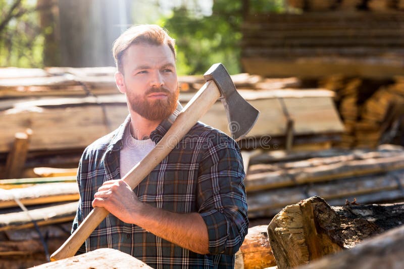 Lumberjack in Checkered Shirt Holding Axe on Shoulder Stock Photo ...