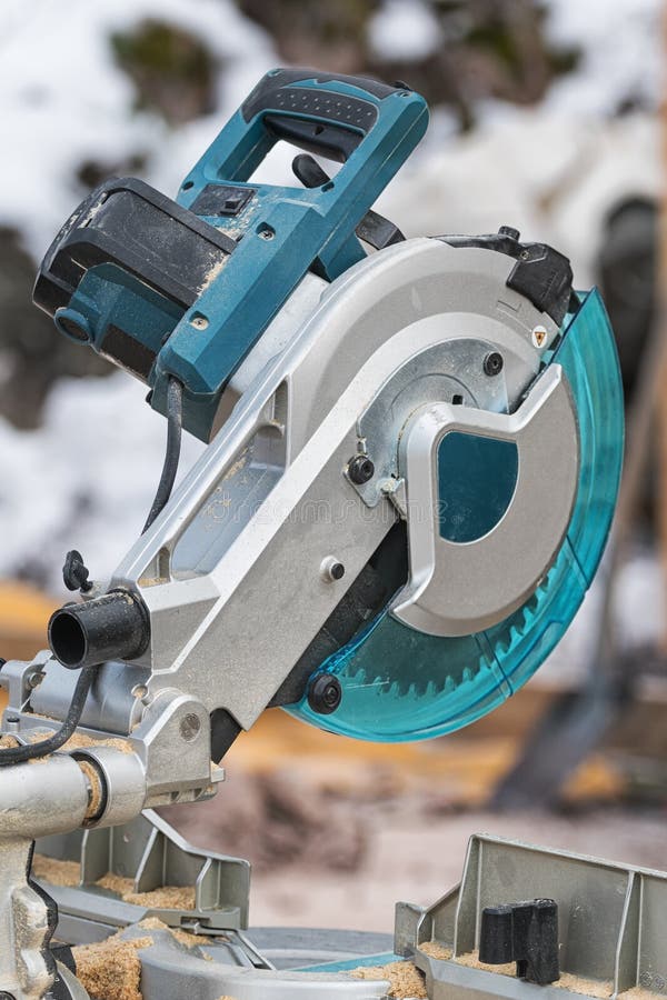 The Lumberjack Cutting the Timber for Lumber by Circular Saw. Stock ...