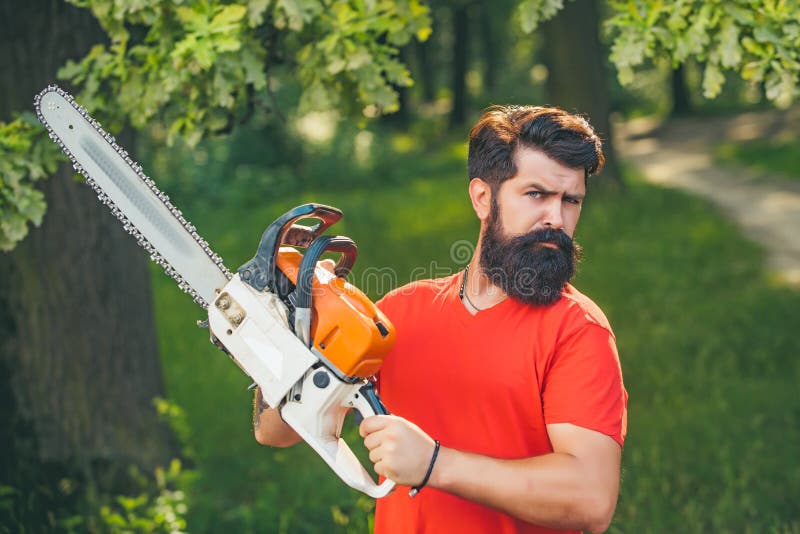Man Holding Chainsaw stock photo. Image of power, lumberjack - 14085560