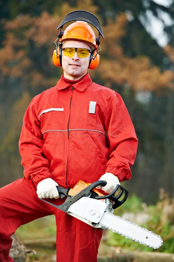 Lumberjack Worker with Chainsaw in the Forest Stock Image - Image of ...