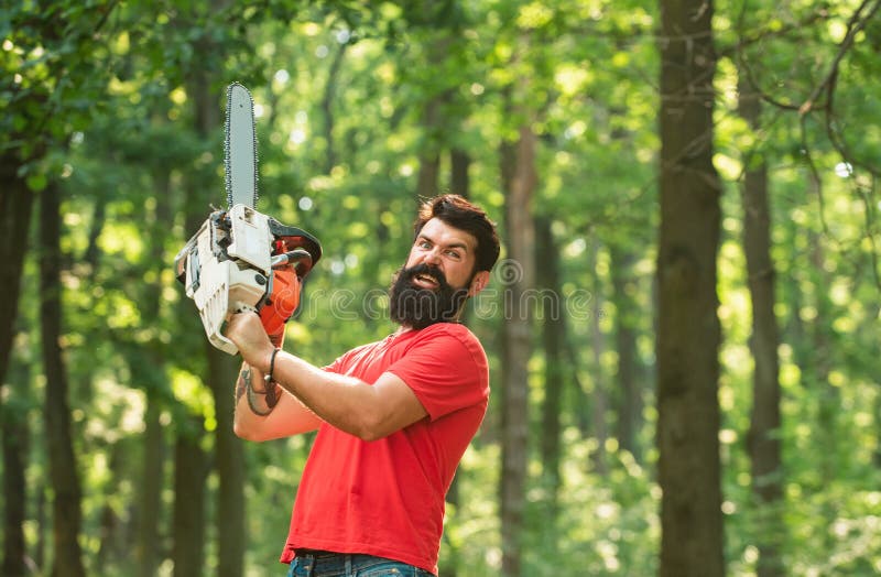 Lumberjack Worker with Chainsaw in the Forest. Lumberjack Worker ...