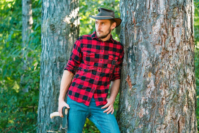 Lumberjack Worker Walking in the Forest with Axe. Lumberjack Worker ...