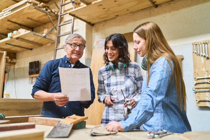 Lumberyard Teamwork with Older and Younger Workers Collaborating Stock ...