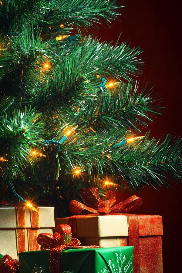 Luminous Christmas Tree with Presents Underneath High Quality Image ...