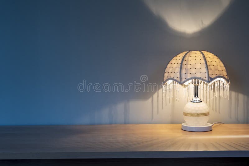 A Luminous Lamp in the Shadow, a Table Lamp on the Desk Stock Photo ...