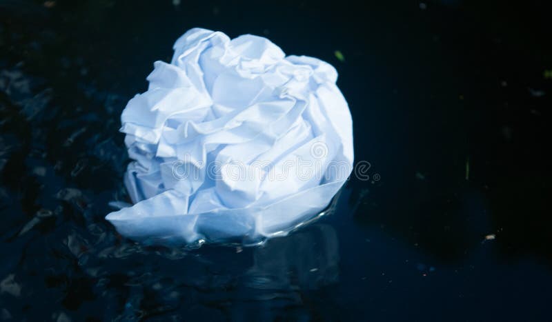 A Lump of Paper Floats in the Water Stock Photo - Image of water, lump ...