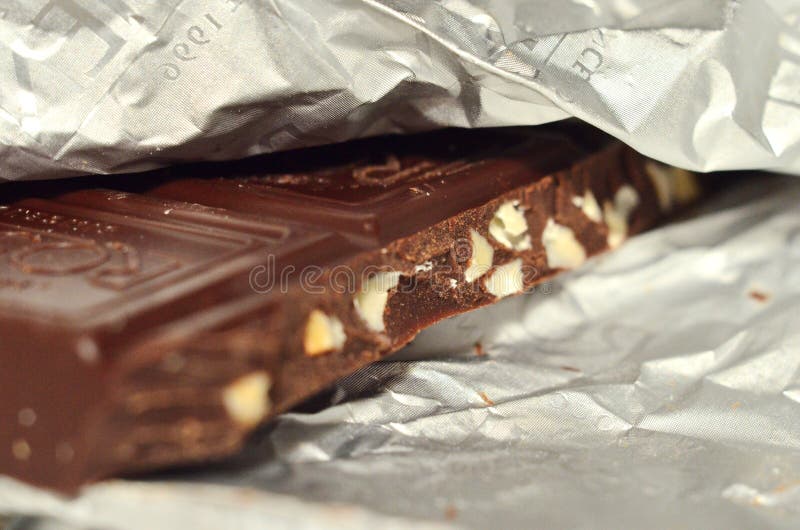 Lumps of Chocolate in Foil stock image. Image of scrap - 50475093