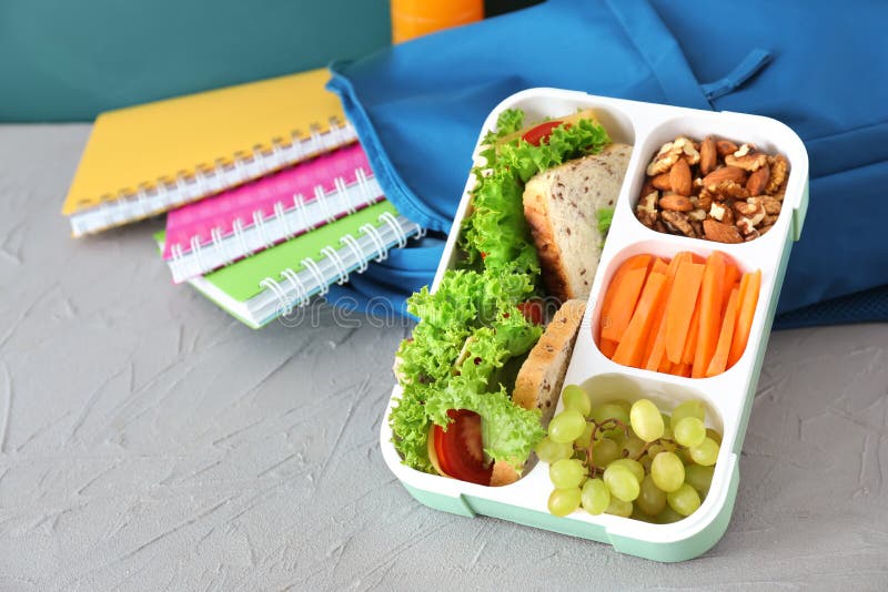 Lunch Box with Appetizing Food and Bag on Table Stock Photo - Image of ...