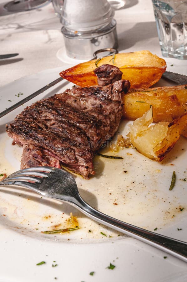 Lunch of Roasted Steak, Medium Rare and Italian Roasted Potatoes at a ...