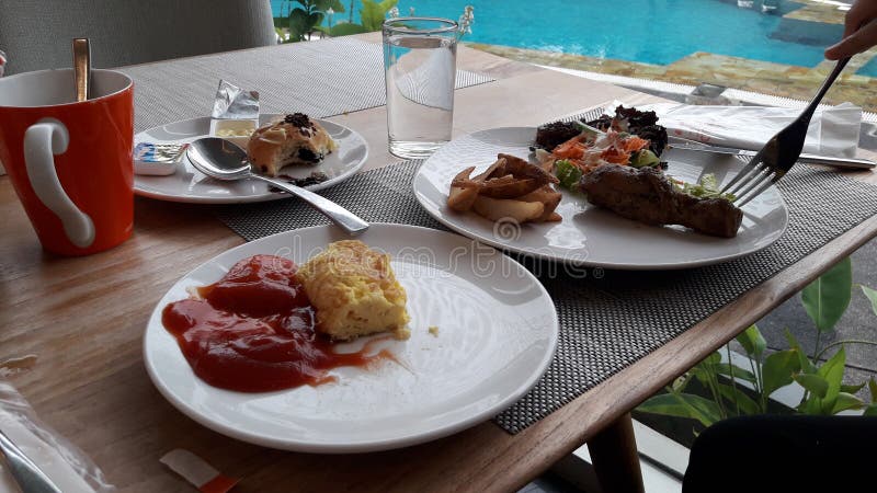 Lunch beside the pool stock image. Image of dish, cuisine - 251621443