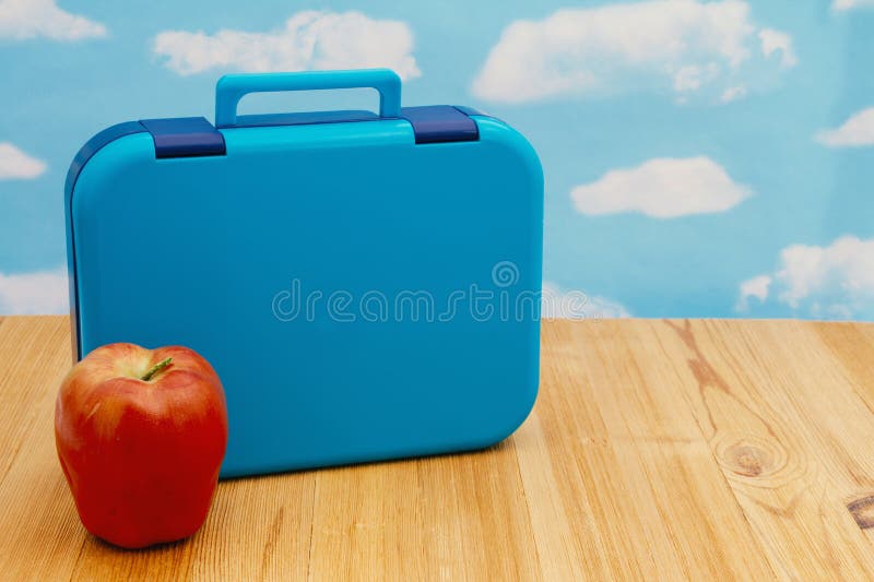 Lunchbox with Apple on Wood Desk with the Sky Stock Photo - Image of ...