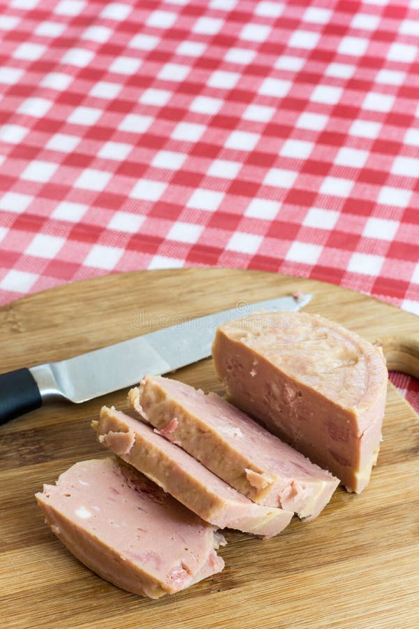 Luncheon Meat on the Wooden Board with Blurred Background Stock Photo ...