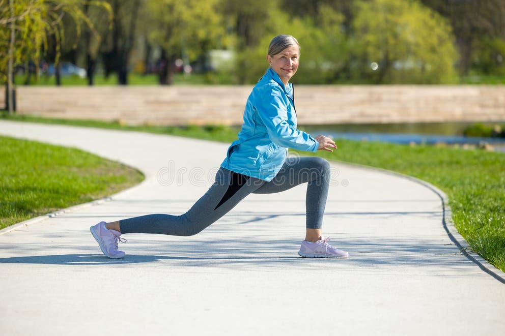 Woman Exercising in the Park and Doing Lunging Stock Image - Image of ...