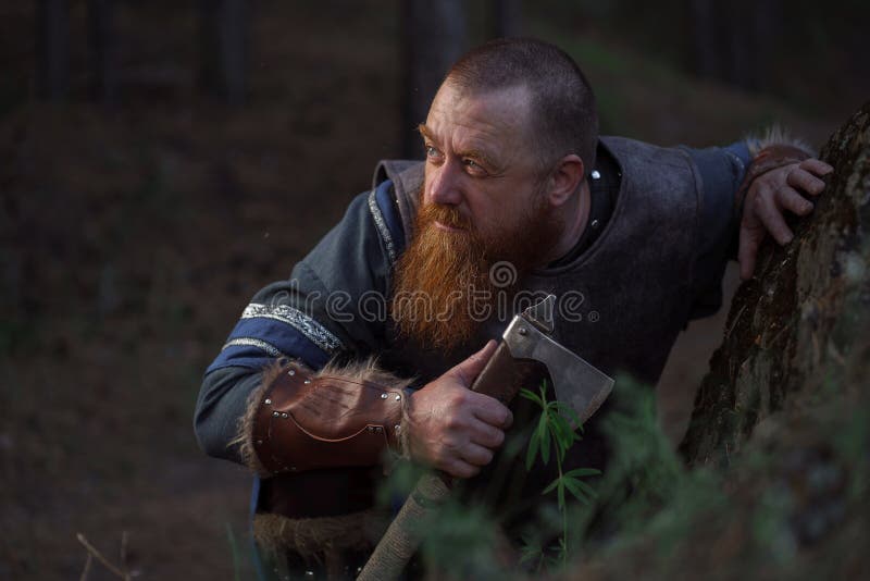 Lurking Medieval Red-haired Viking Warrior with Beard with an Ax in ...