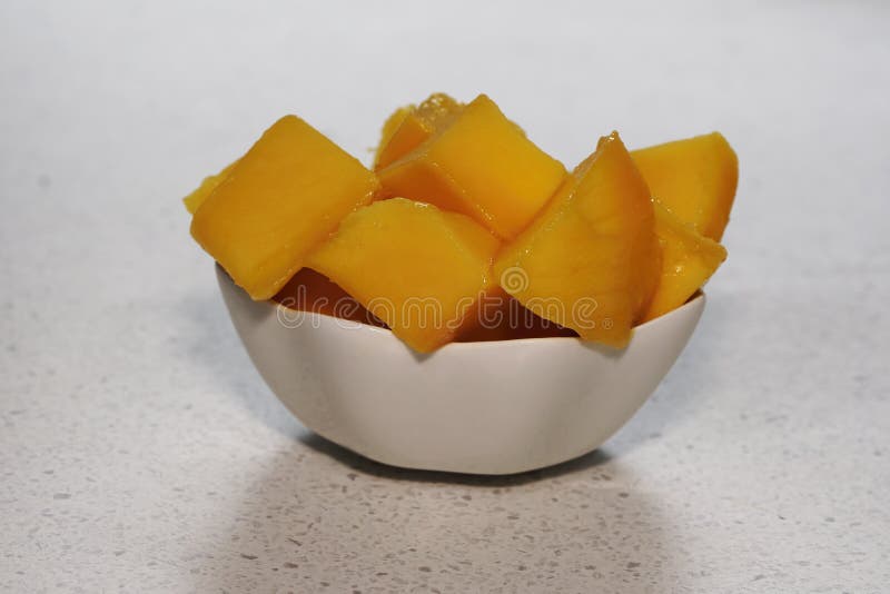Fresh cut mango in a dish stock photo. Image of delicious - 238149738