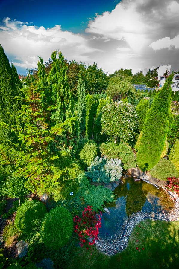 Lush garden stock image. Image of pond, greenery, vertical - 26961879