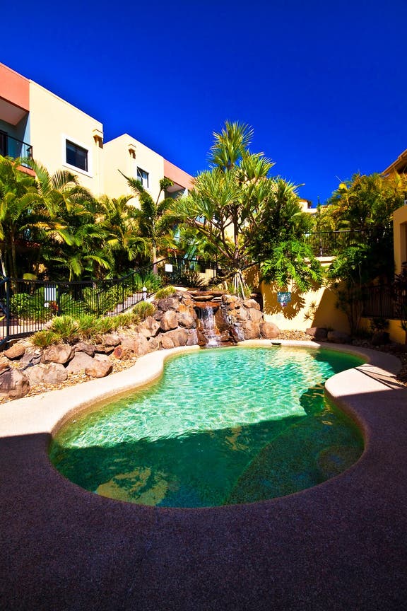 Lush Resort Pool stock image. Image of swim, swimming - 12772553