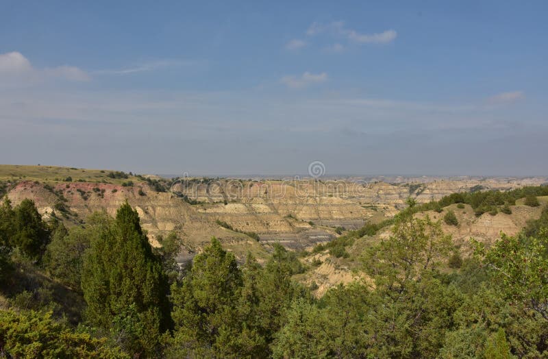 Lush Trees on the Edges of the Badlands Stock Image - Image of travel ...