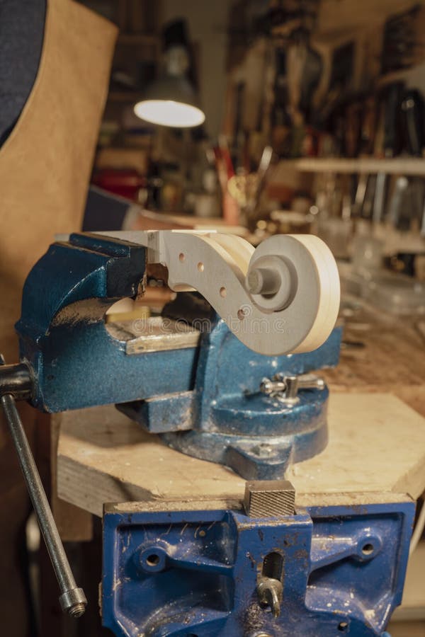 Luthier Working on Violin Scroll Using a Bench Vise in His Workshop ...