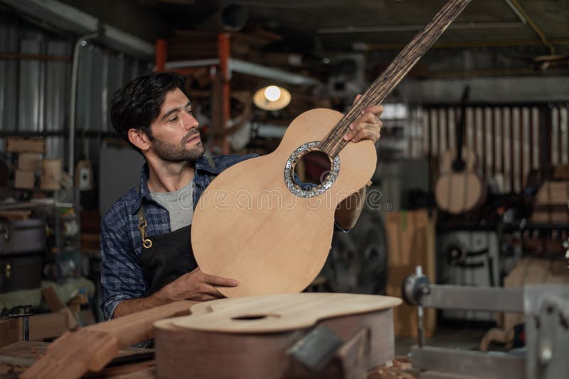 Luthier Creating a Guitar and Using Tools in a Traditional Stock Image ...