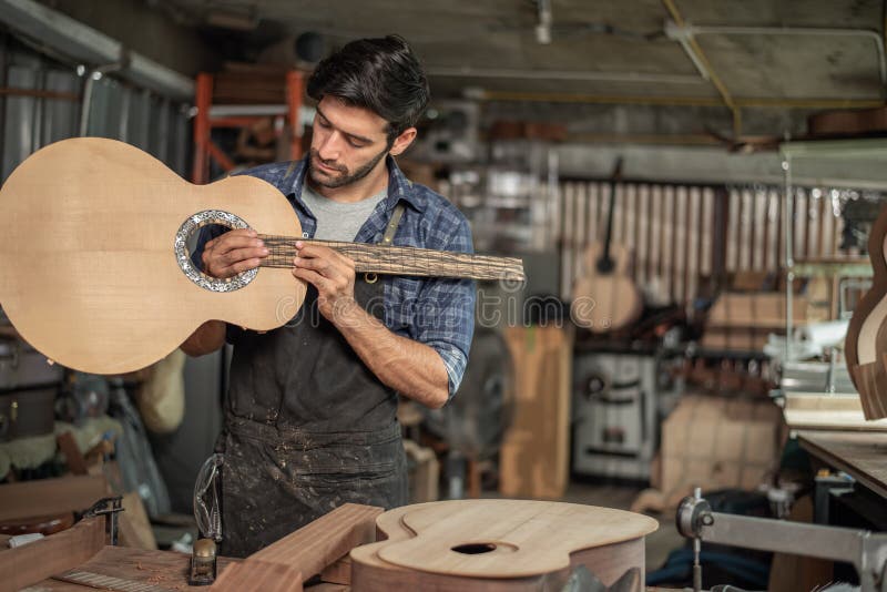 Luthier Creating a Guitar and Using Tools in a Traditional Stock Image ...