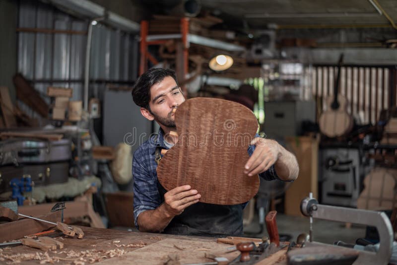 Luthier Creating a Guitar and Using Tools in a Traditional Stock Image ...