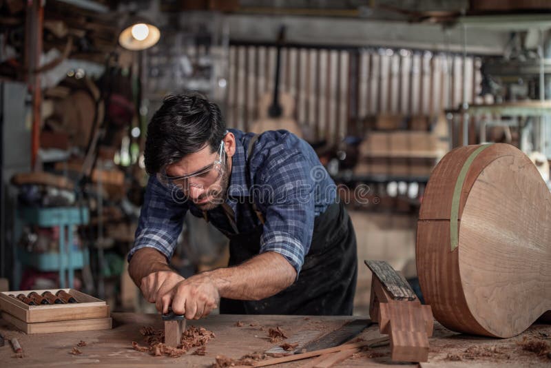 Luthier Creating a Guitar and Using Tools in a Traditional Stock Photo ...