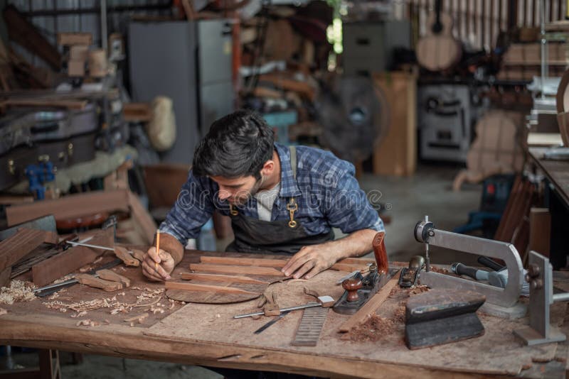 Luthier Creating a Guitar and Using Tools in a Traditional Stock Photo ...