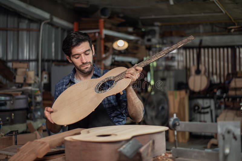 Luthier Creating a Guitar and Using Tools in a Traditional Stock Photo ...