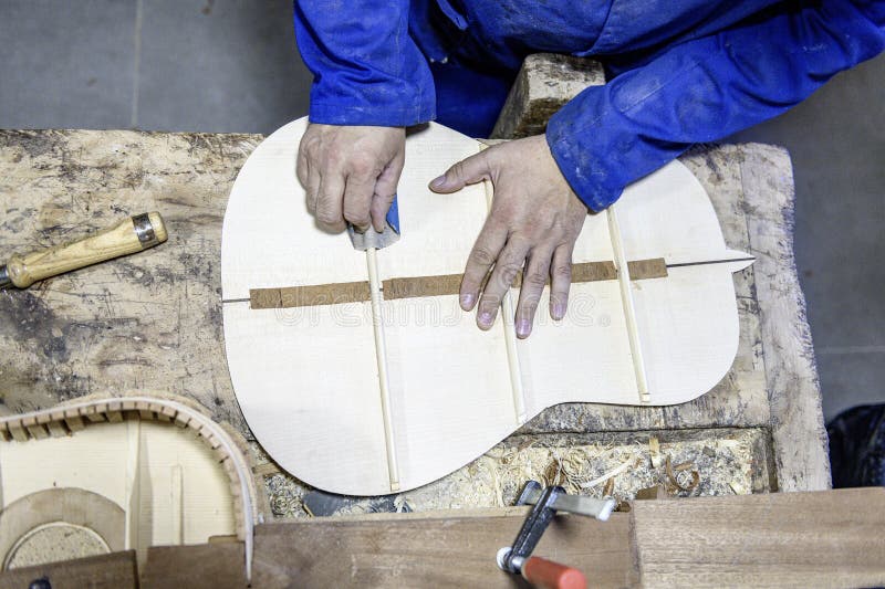Luthier Sanding Internal Back Braces of Handmade Flamenco Guitar in ...