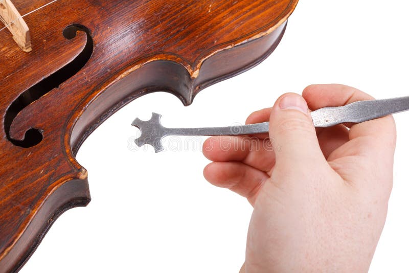 Using the Sound Post Setter Stock Image - Image of worn, hole: 117040461