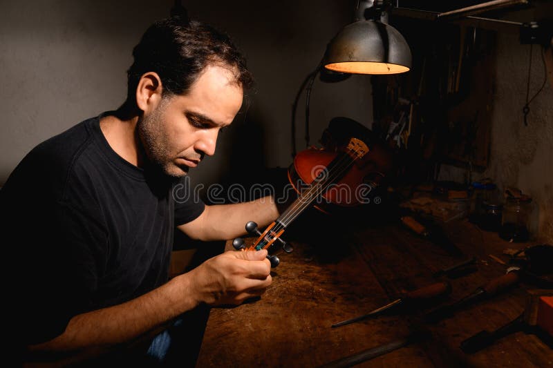 Luthier works on a violin stock image. Image of making - 338543433