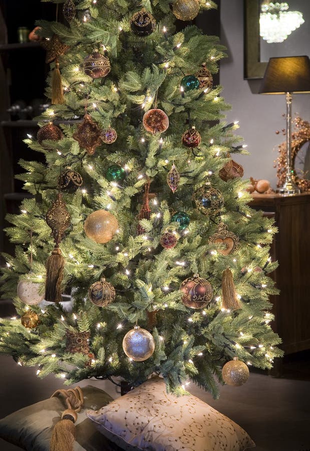 Presents Under Decorated Christmas Tree in Den Stock Photo - Image of ...