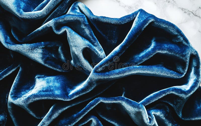 Luxurious Dark Blue Velvet Fabric Draped Elegantly on a Marble Surface ...