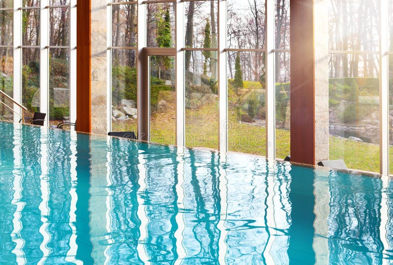 Luxurious Empty Infinity Swimming Pool with Big Glass Windows. Stock ...