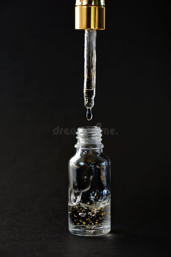 Luxurious Facial Serum Container with Dropper on Black Background Stock ... Luxurious Facial Serum Container with Dropper on Black Background Stock ...