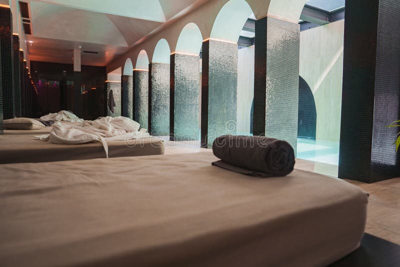 Luxurious Indoor Spa with Elegant Archways and Serene Pool in High-End ...