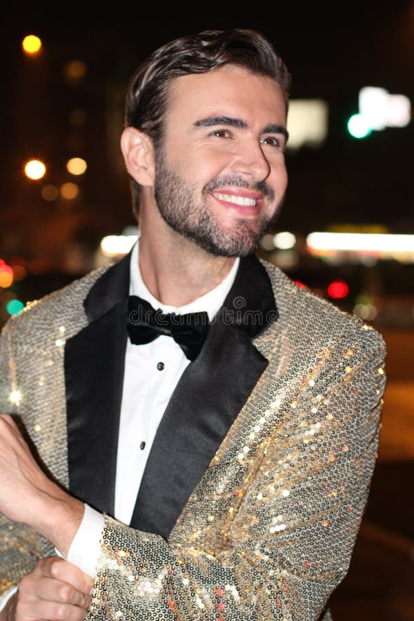 Luxurious Looking Man in Sparkly Golden Tuxedo Smiling Stock Photo ...