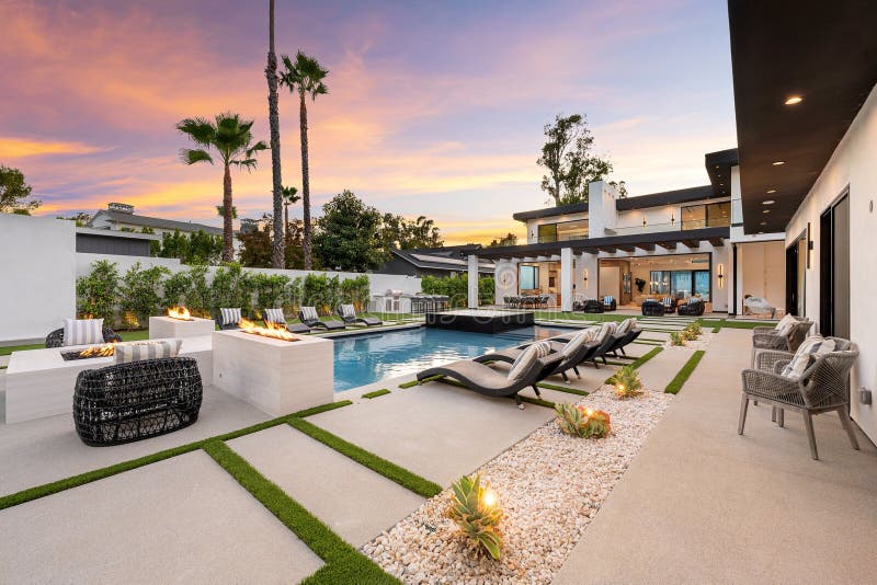 Luxurious Modern Backyard with Pool at Sunset. Stock Photo - Image of ...