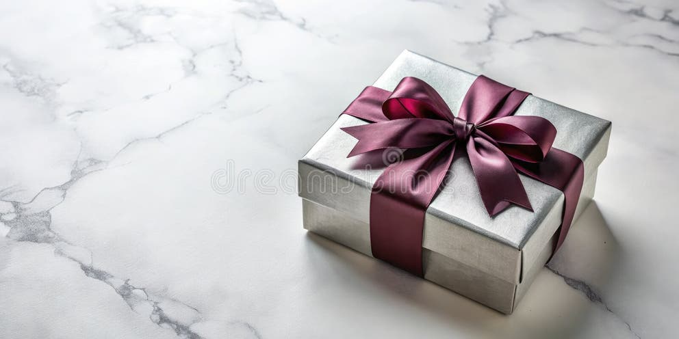 A Luxurious Silver Gift Box Elegantly Wrapped with a Maroon Bow Set ...