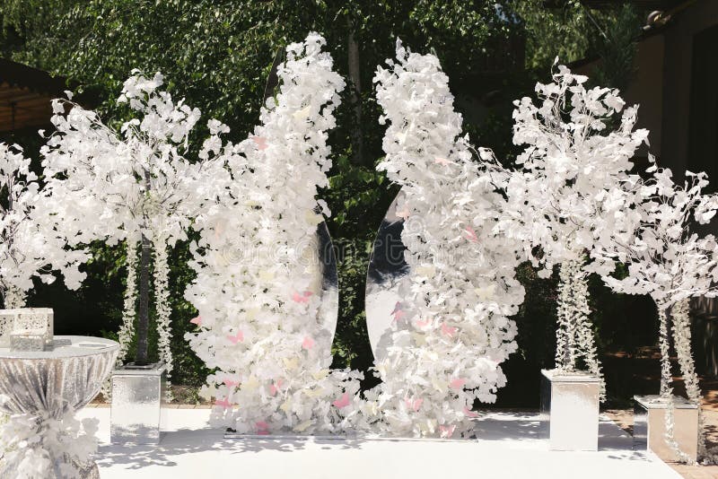 A Luxurious White Wedding Arch in the Open Air. Stock Image - Image of ...