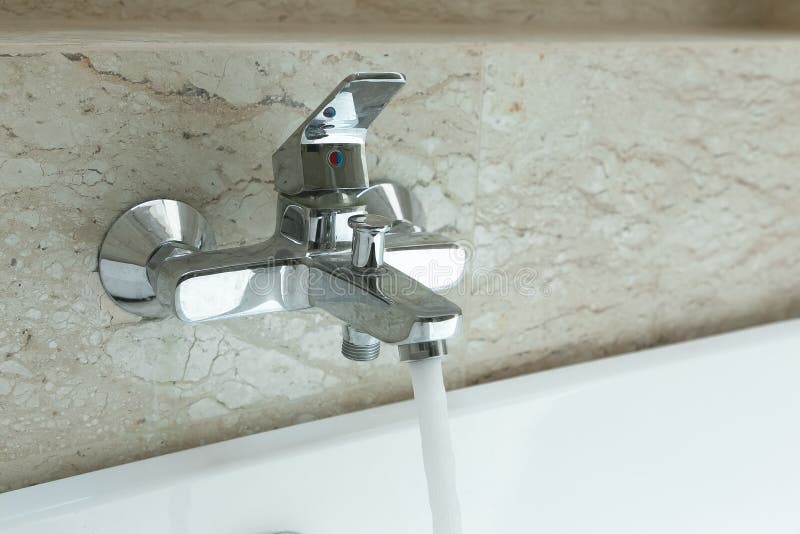 Luxury Bath Tub and Faucet with Water Stock Image - Image of modern ...