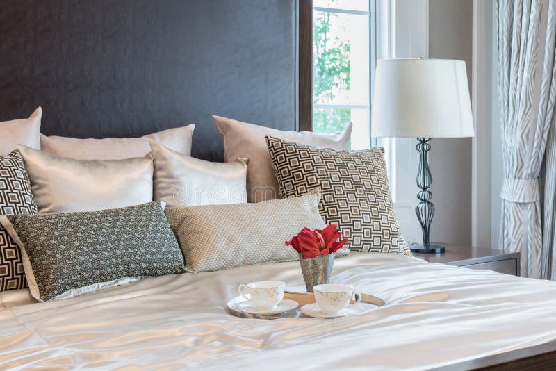 Luxury Bedroom Interior with Brown Pattern Pillows on Bed Stock Photo ...