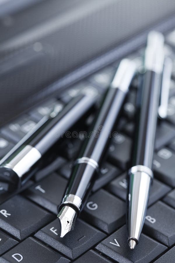 Luxury Black Pen on Computer Keyboard Stock Photo - Image of business ...