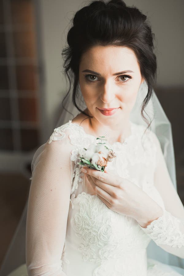 Luxury Bride in White Dress Posing while Preparing for the Wedding ...