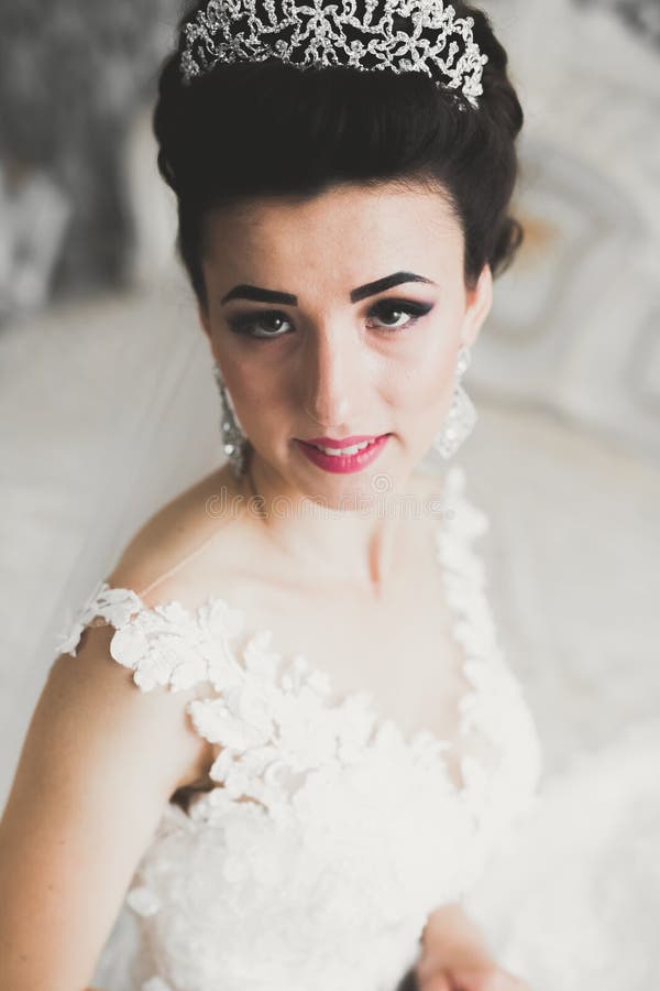 Luxury Bride in White Dress Posing while Preparing for the Wedding ...