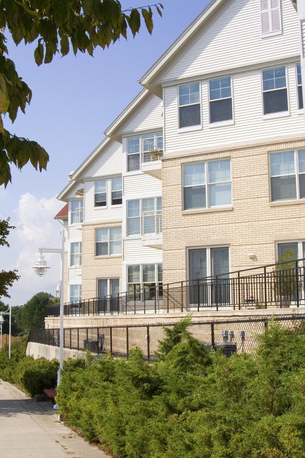 Row of Brick Condos with Bay Windows Stock Photo - Image of expensive ...